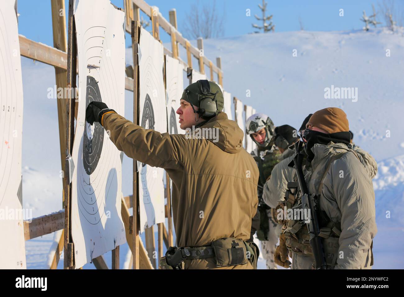 A Finnish army soldier provides constructive feedback to soldiers of ...
