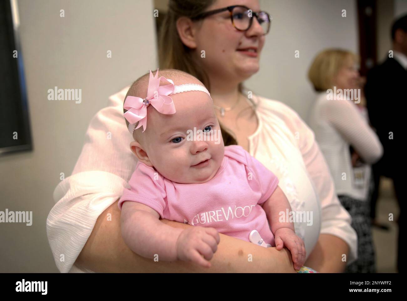 Merle Wittig, one of the Baudinet family au pairs, holds Ava Louise ...