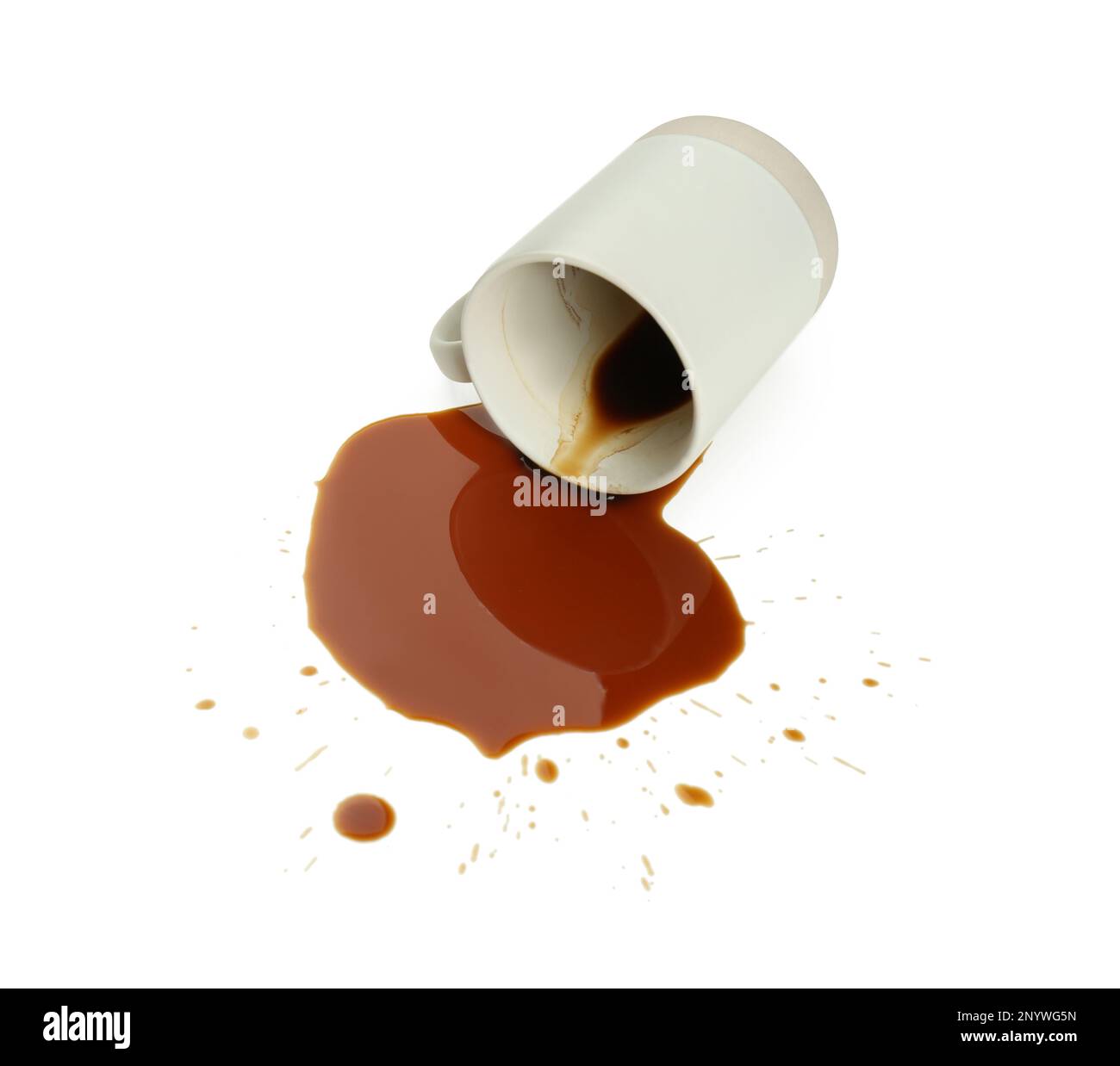 Overturned cup and spilled coffee on white background Stock Photo - Alamy