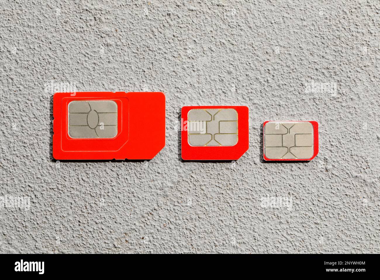 Different SIM cards on stone background, flat lay Stock Photo - Alamy