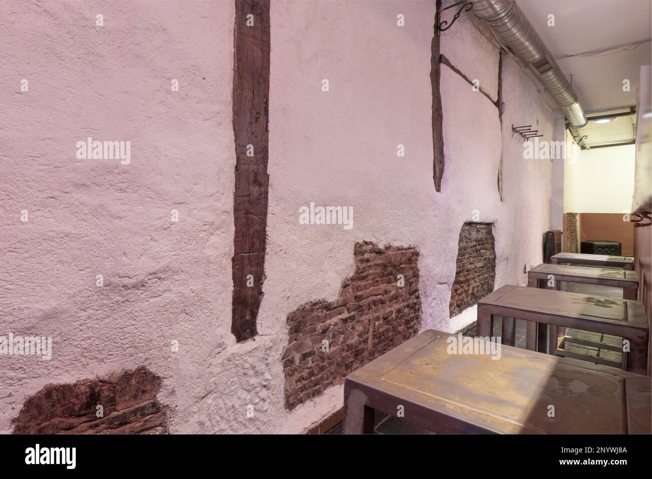 Elongated hall of an empty restaurant with industrial-style metal ...