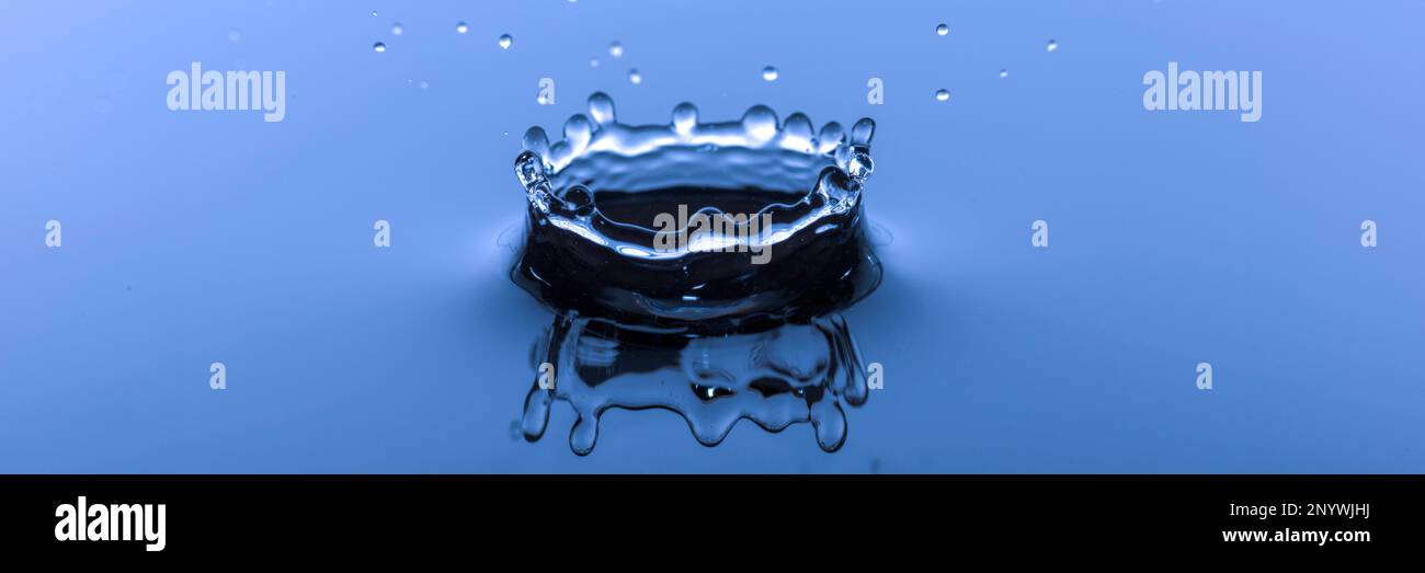 water drop splashing on surface Stock Photo - Alamy