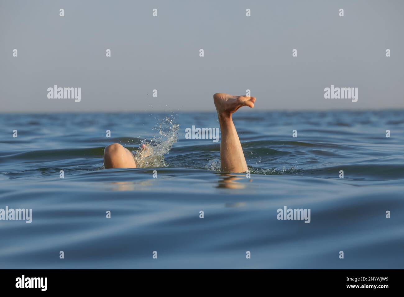 Feet sticking out of water hi-res stock photography and images - Alamy