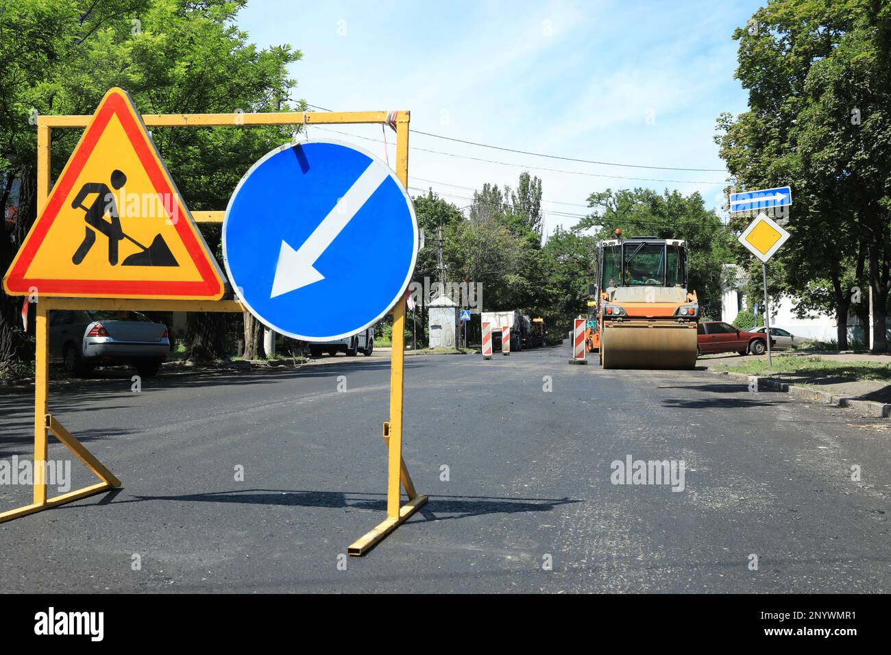 Barricade with traffic signs on city street. Road repair Stock Photo ...