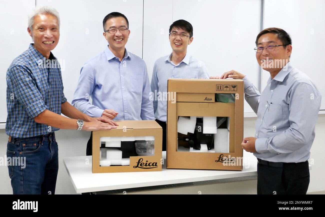 SME spotlight series on MNCs and SMEs : (From left) Leica service engineer Dave Wong, with the ...