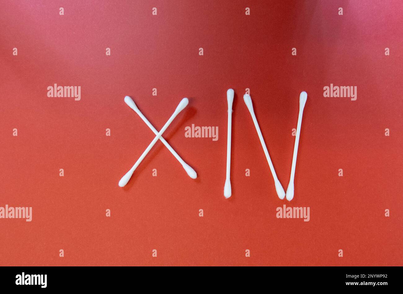 number fourteen (14) in roman numerals with clean white cotton buds ...