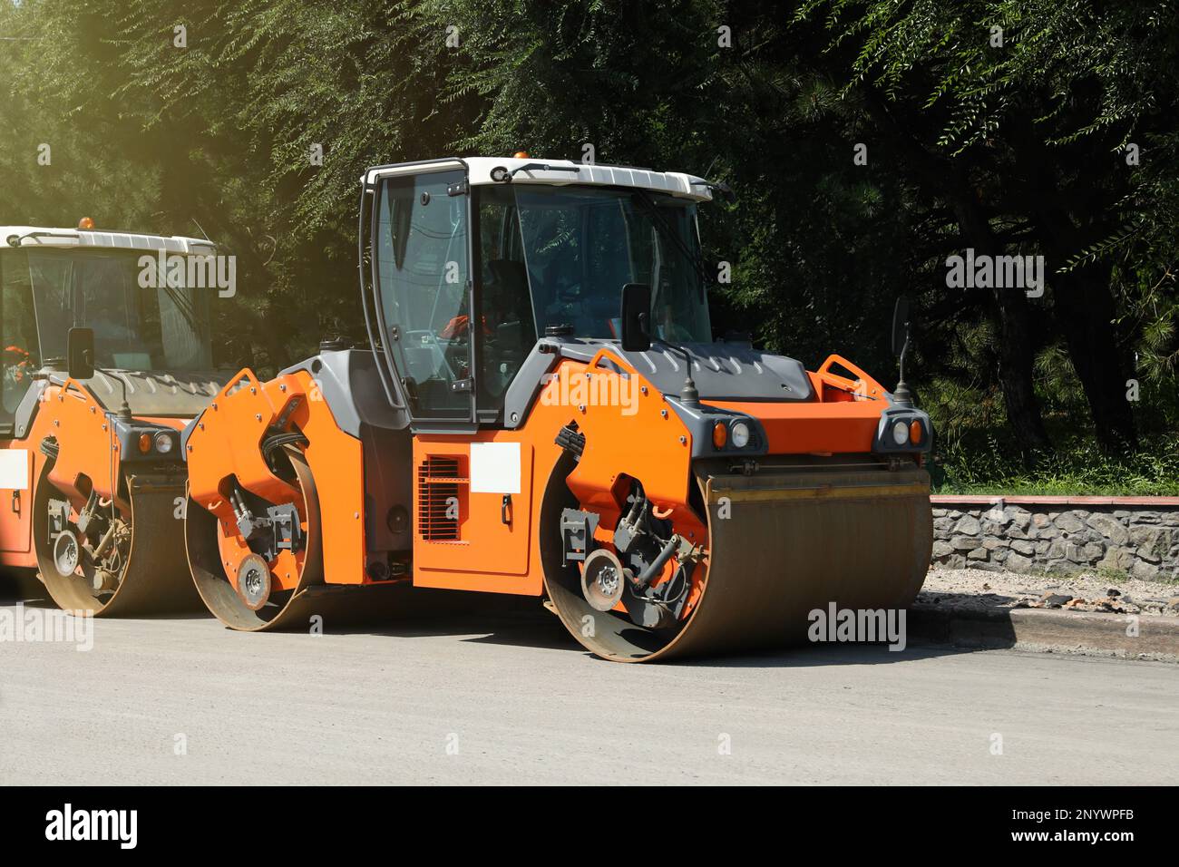 Modern rollers on city street. Road repair service Stock Photo - Alamy