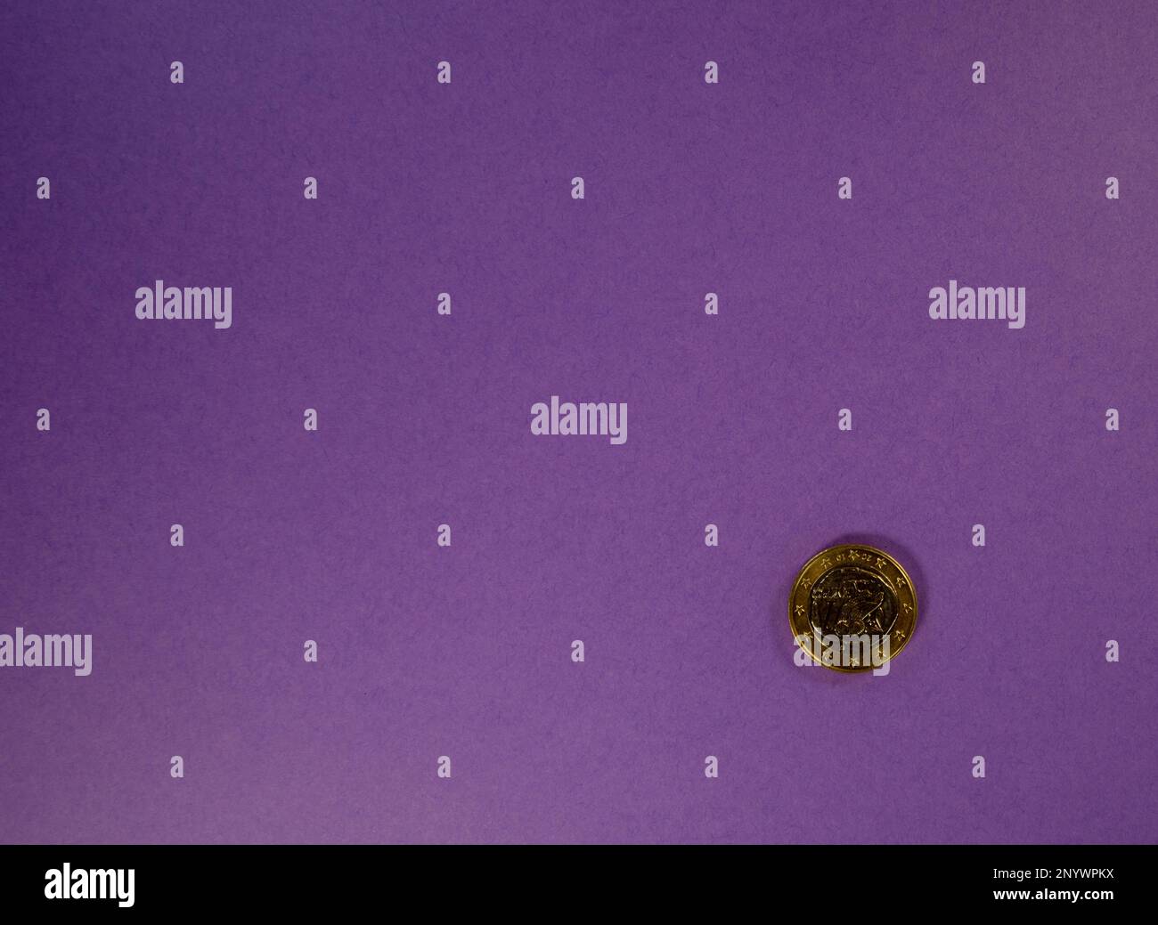 one Euro coins heads down isolated on a purple background Stock Photo ...