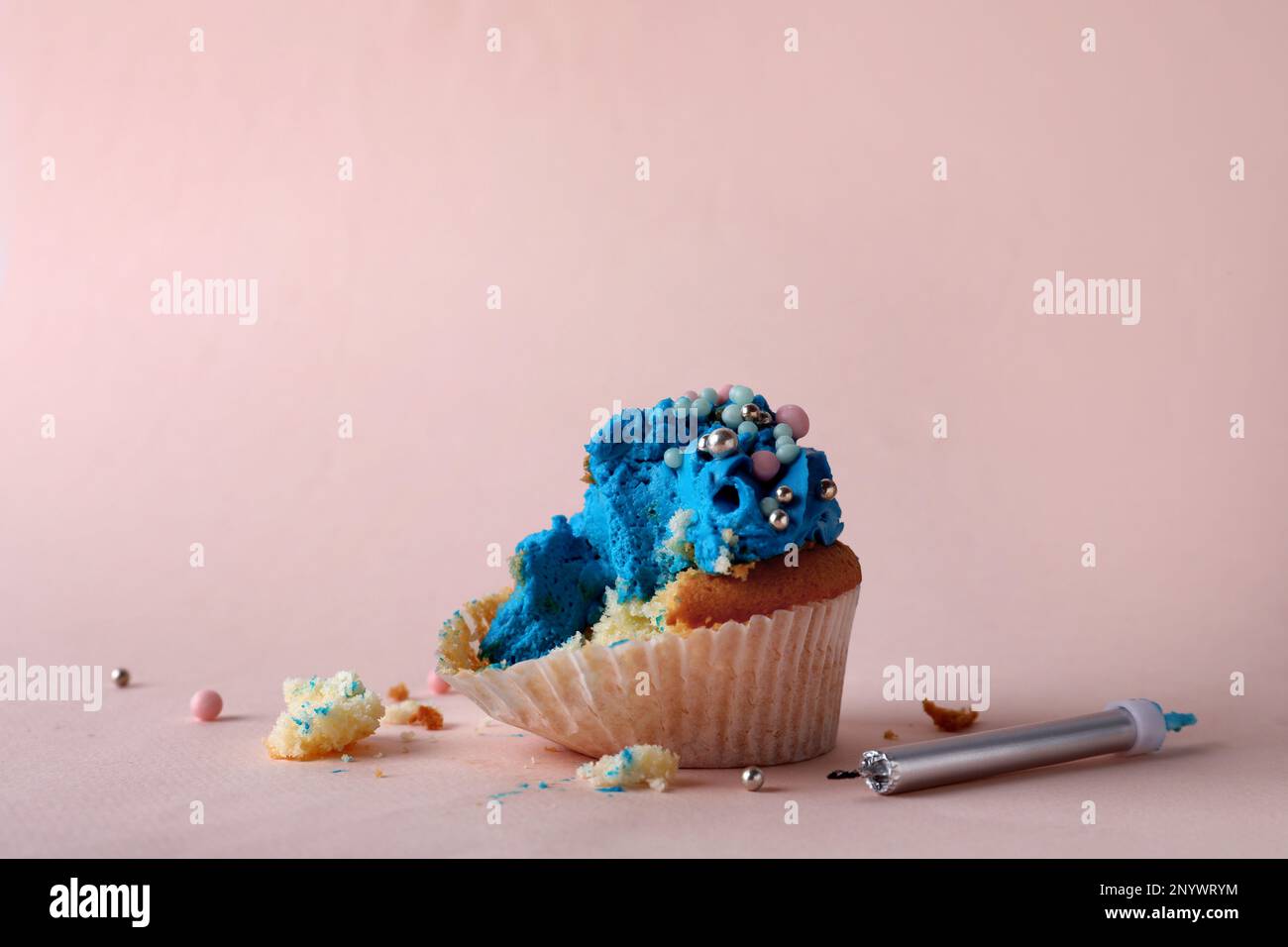 Failed cupcake and candle on pink background. Troubles happen Stock ...