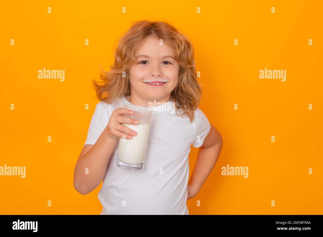 Kid drink milk with funny emotions on yellow background. Child drinking ...