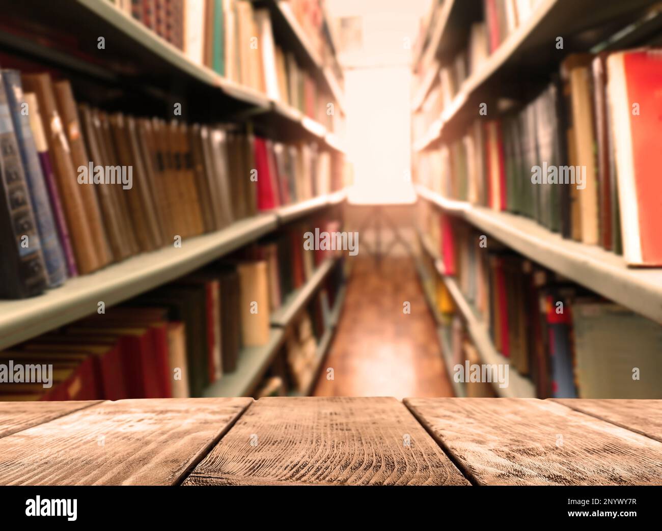 Empty wooden table in library. Space for design Stock Photo - Alamy