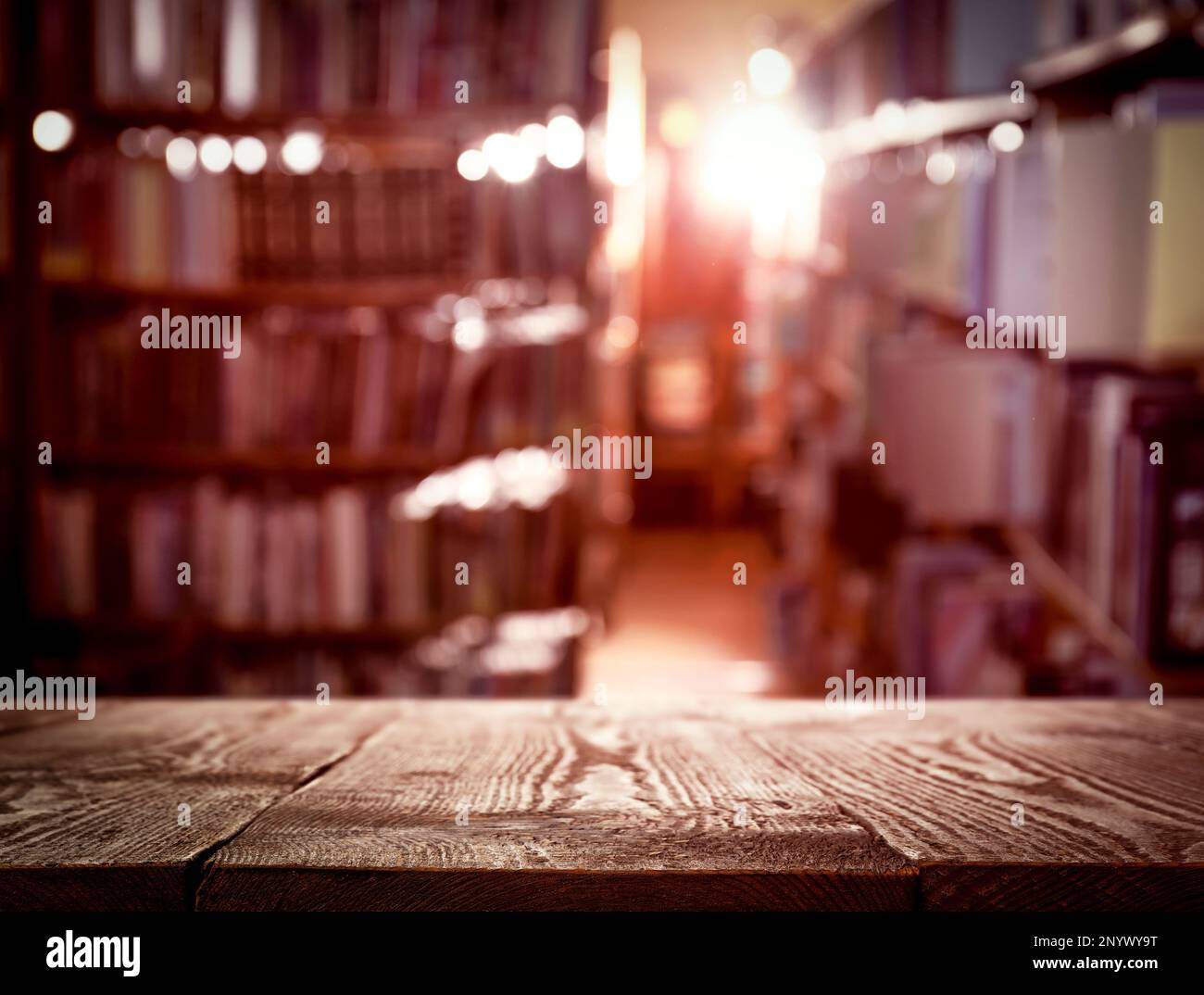 Empty wooden table in library. Space for design Stock Photo - Alamy