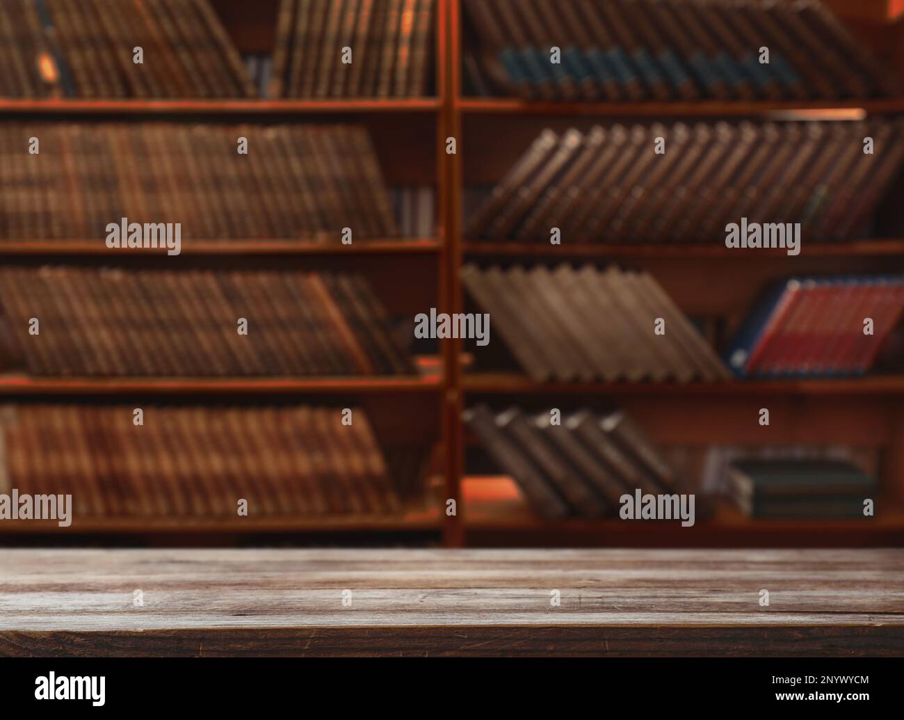 Empty wooden table in library. Space for design Stock Photo - Alamy