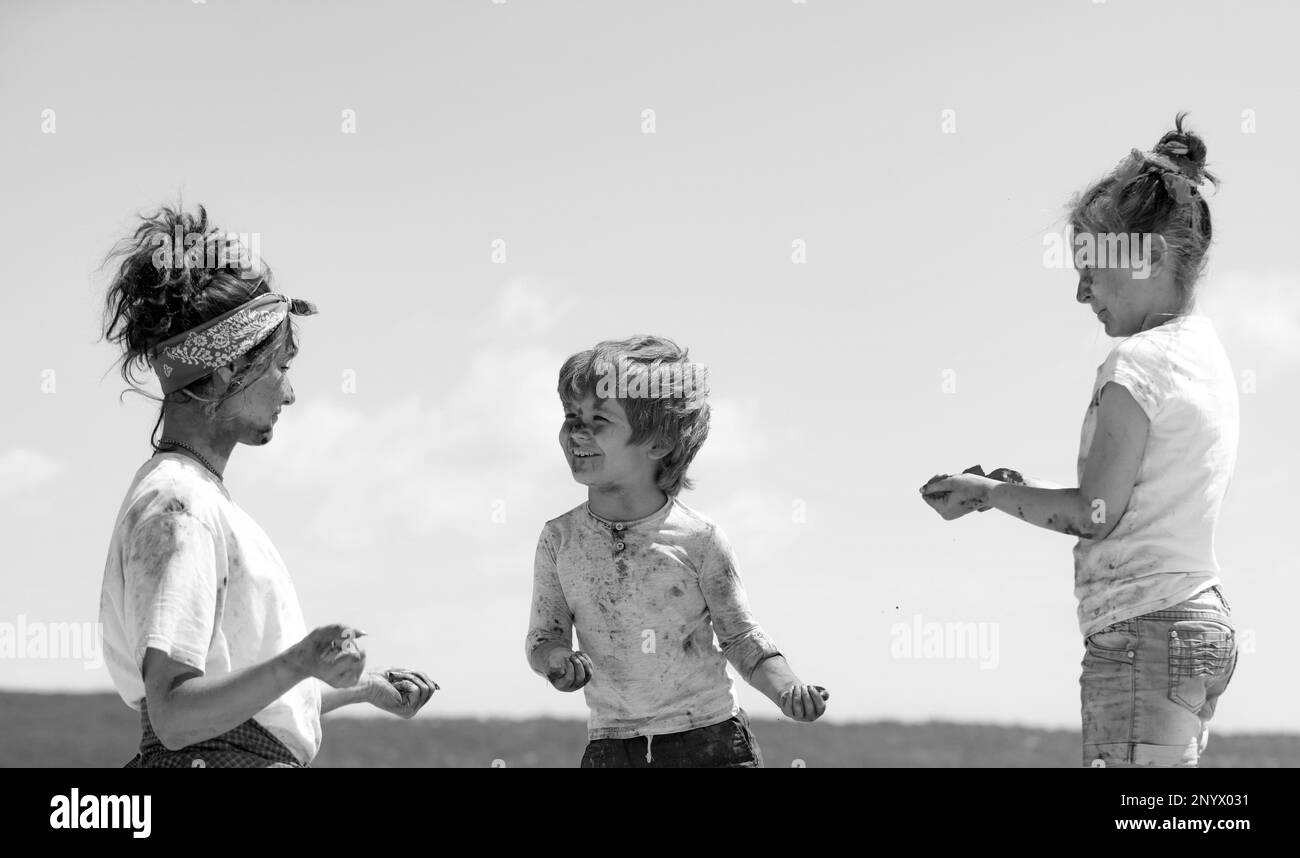 Happy childhood. Kids playing with colours. Holi festival of colors ...