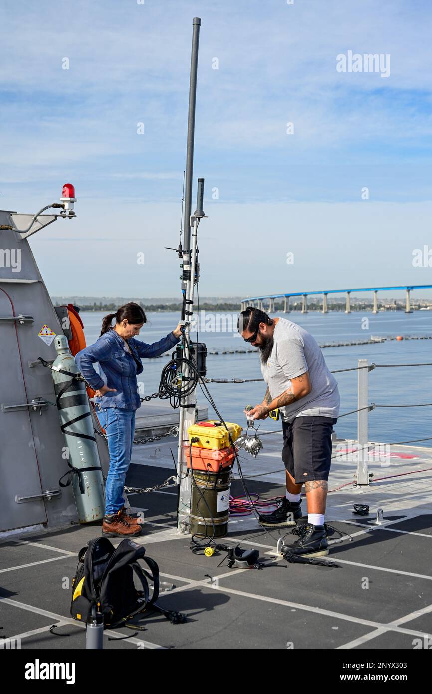 Transponder Lab Lead Alma Holt, left, and Engineering Technician 2nd Class Ronnie Robles, both ...