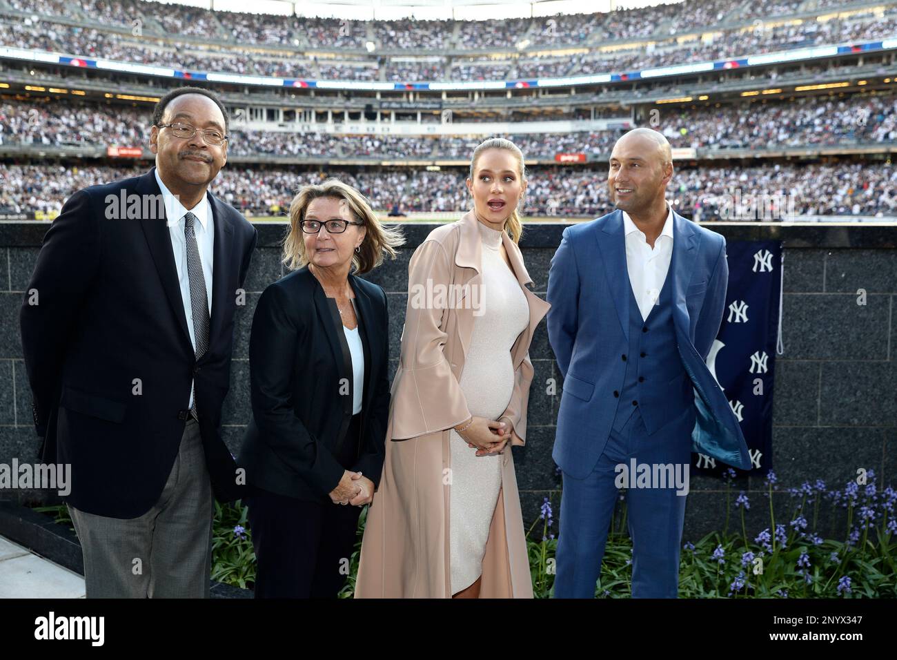 Former New York Yankee Derek Jeter, right, his wife Hannah Jeter ...