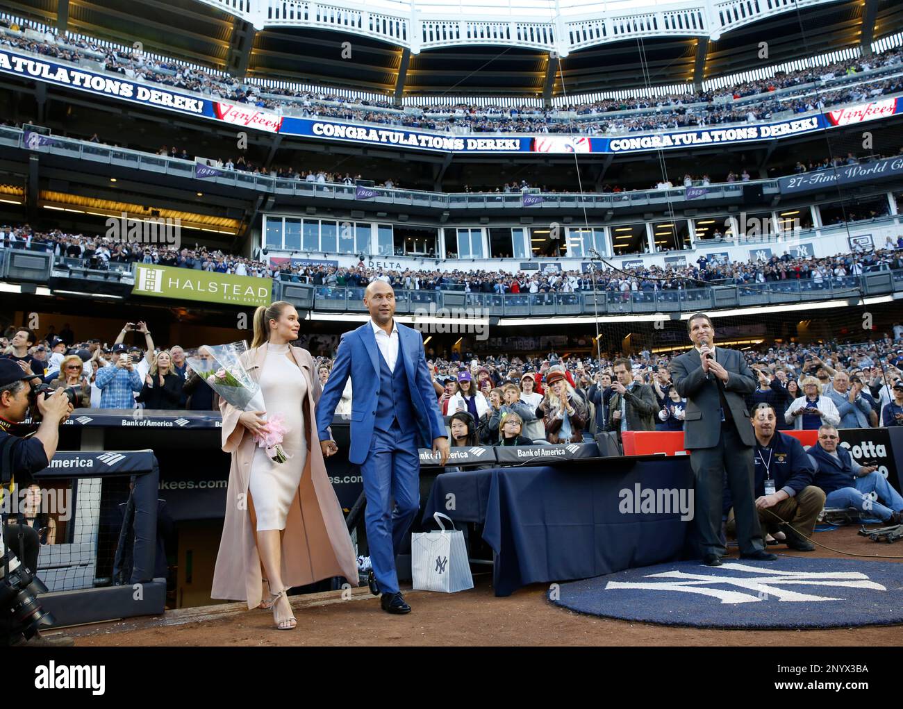 Retired New York Yankees shortstop Derek Jeter and his wife Hannah walk ...
