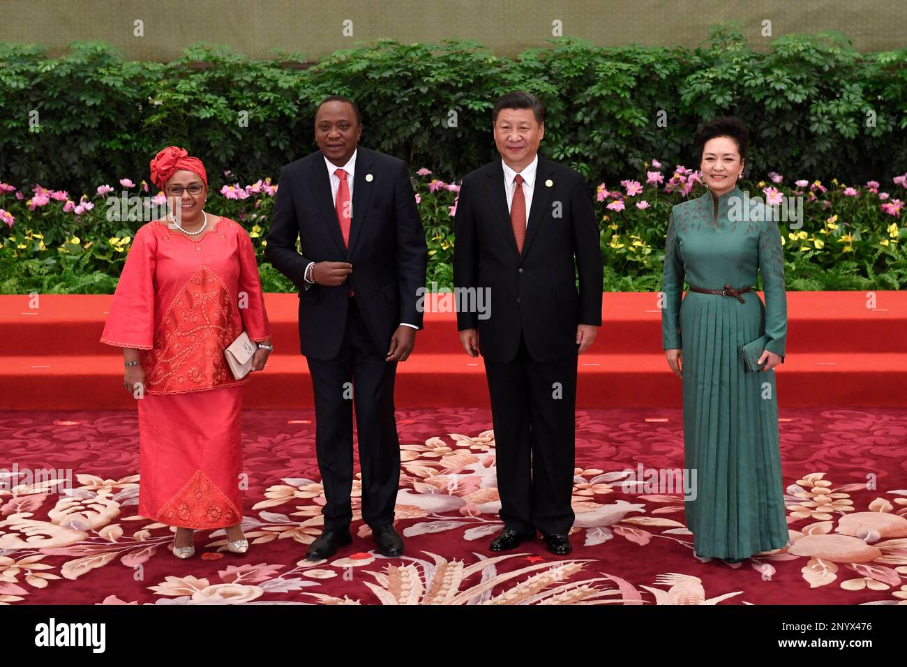 Chinese President Xi Jinping, center right, and his wife Peng Liyuan, pose for a photo with ...