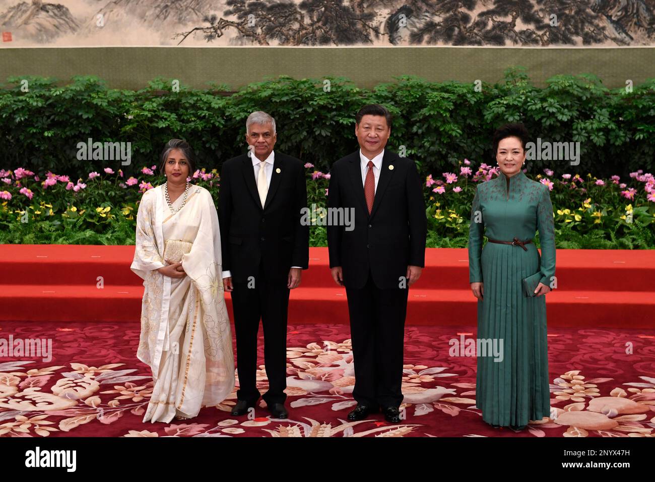 Chinese President Xi Jinping, center right, and his wife Peng Liyuan, pose for a photo with Sri ...