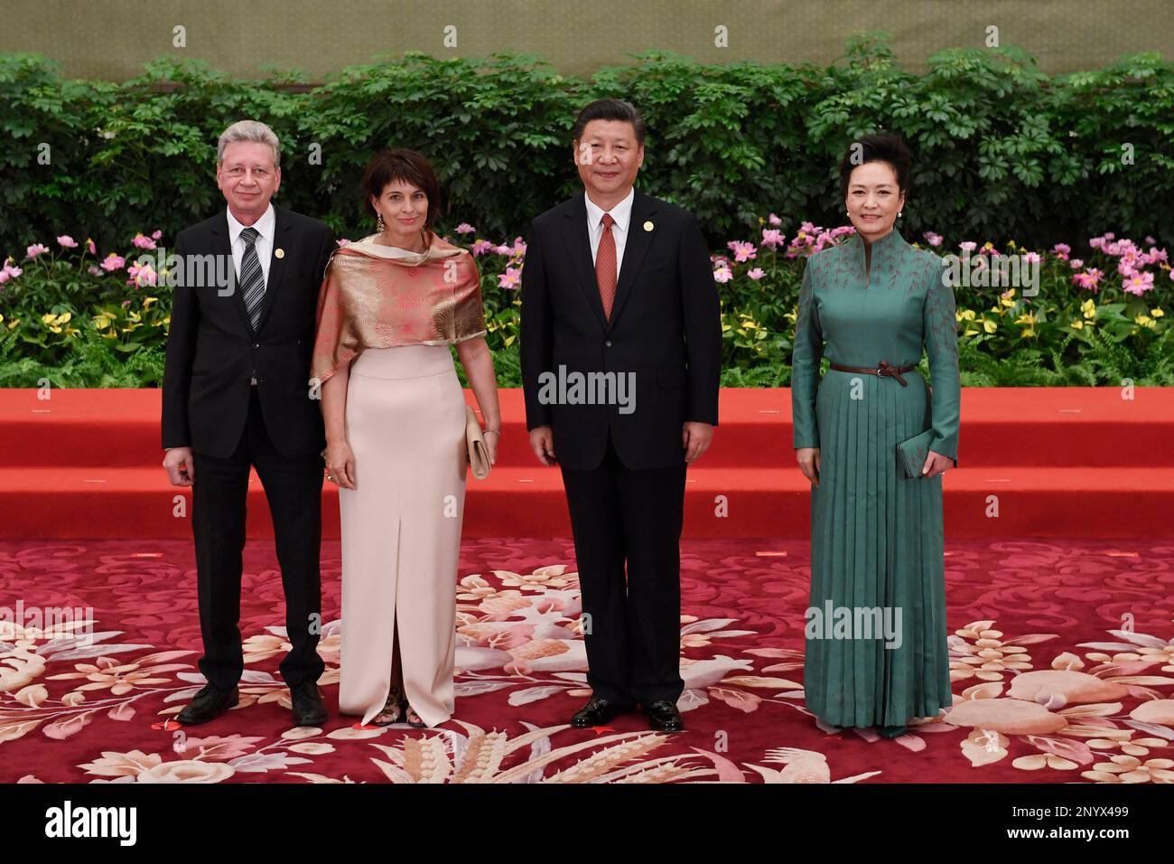 Chinese President Xi Jinping, center right, and his wife Peng Liyuan pose for a photo with Swiss ...