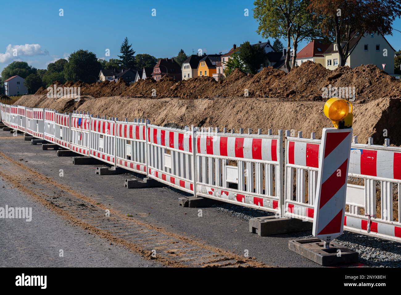 Red and white plastic construction fence. A large group of plastic ...