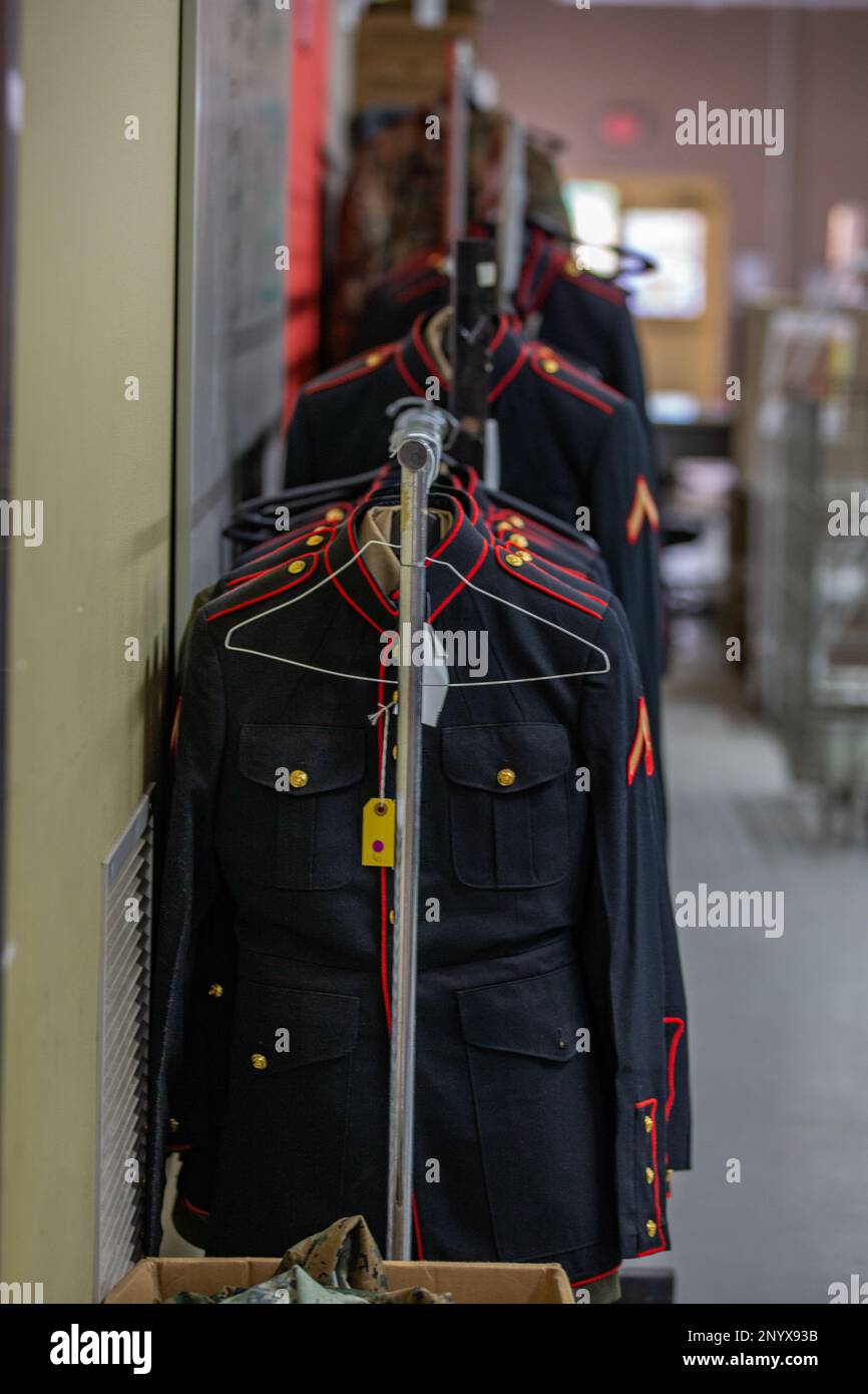 U.S. Marine Corps Dress Blue coats are hung in preparation to be ...