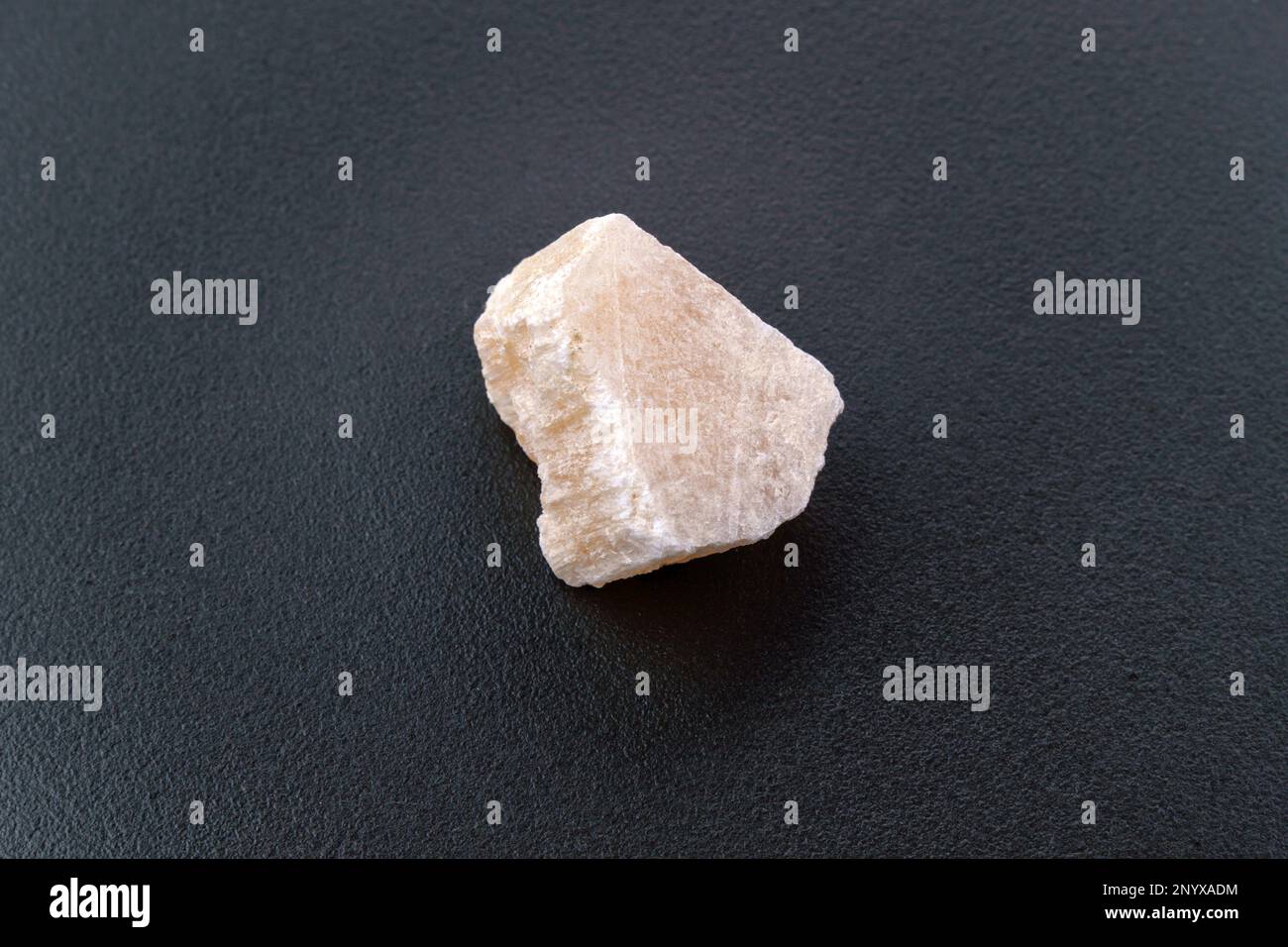 Red Gypsum stone mineral, black background, close-up, black background ...