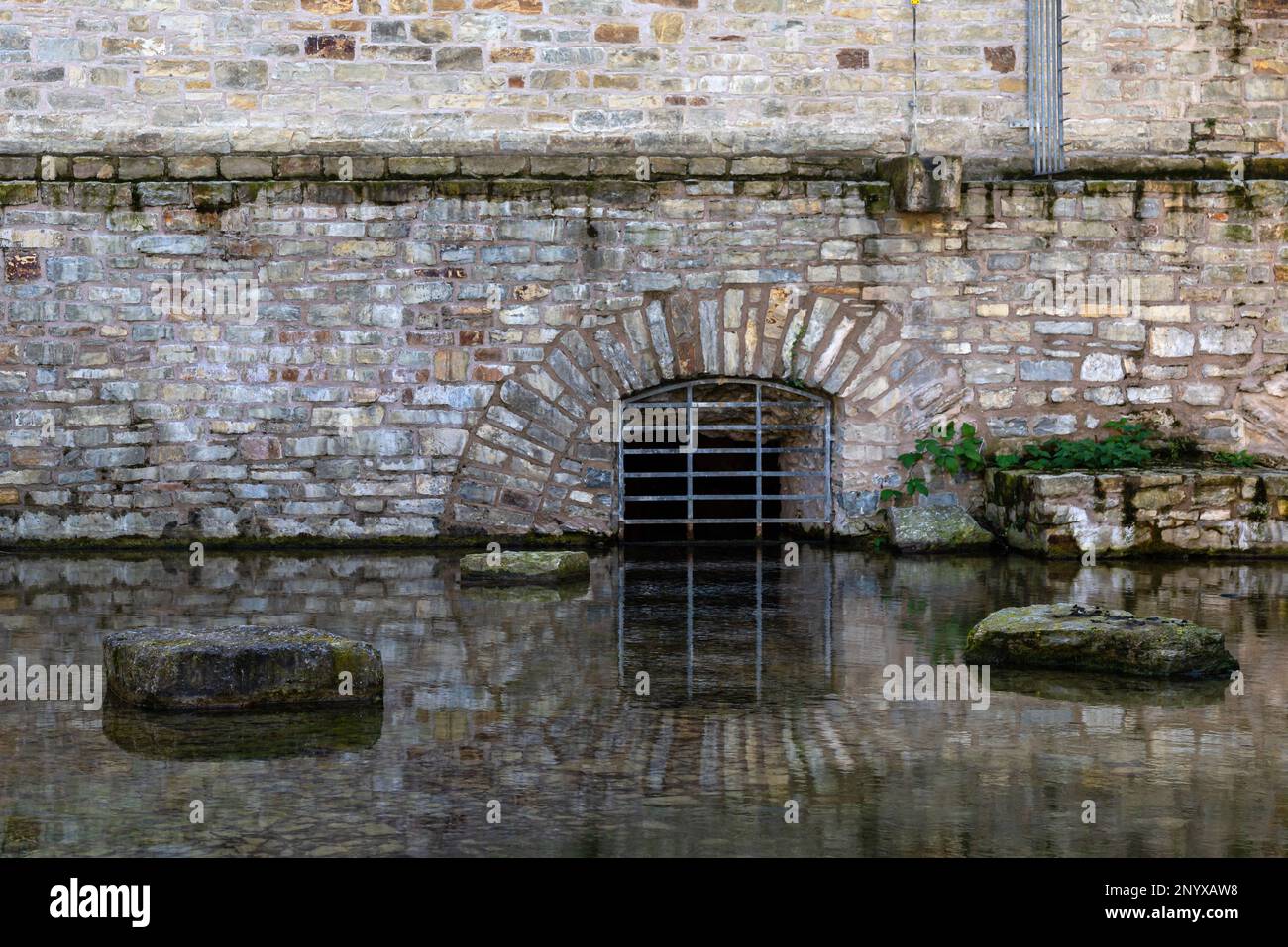 The basement curtained window of an ancient building is reflected in ...