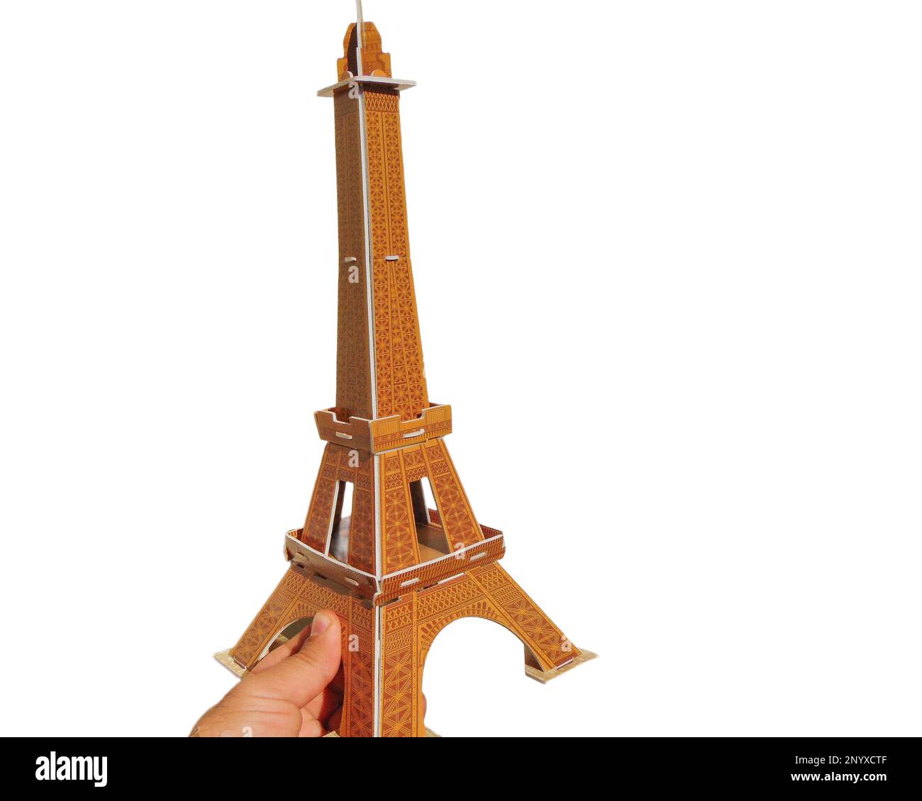 a person holds in his hand the Eiffel Tower made of 3d puzzle Stock ...