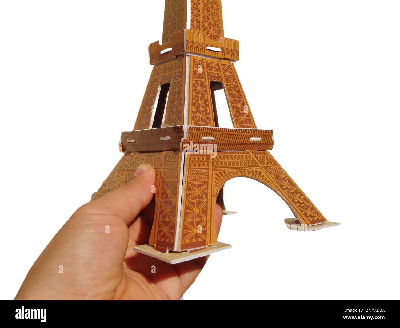 a person holds in his hand the Eiffel Tower made of 3d puzzle Stock ...