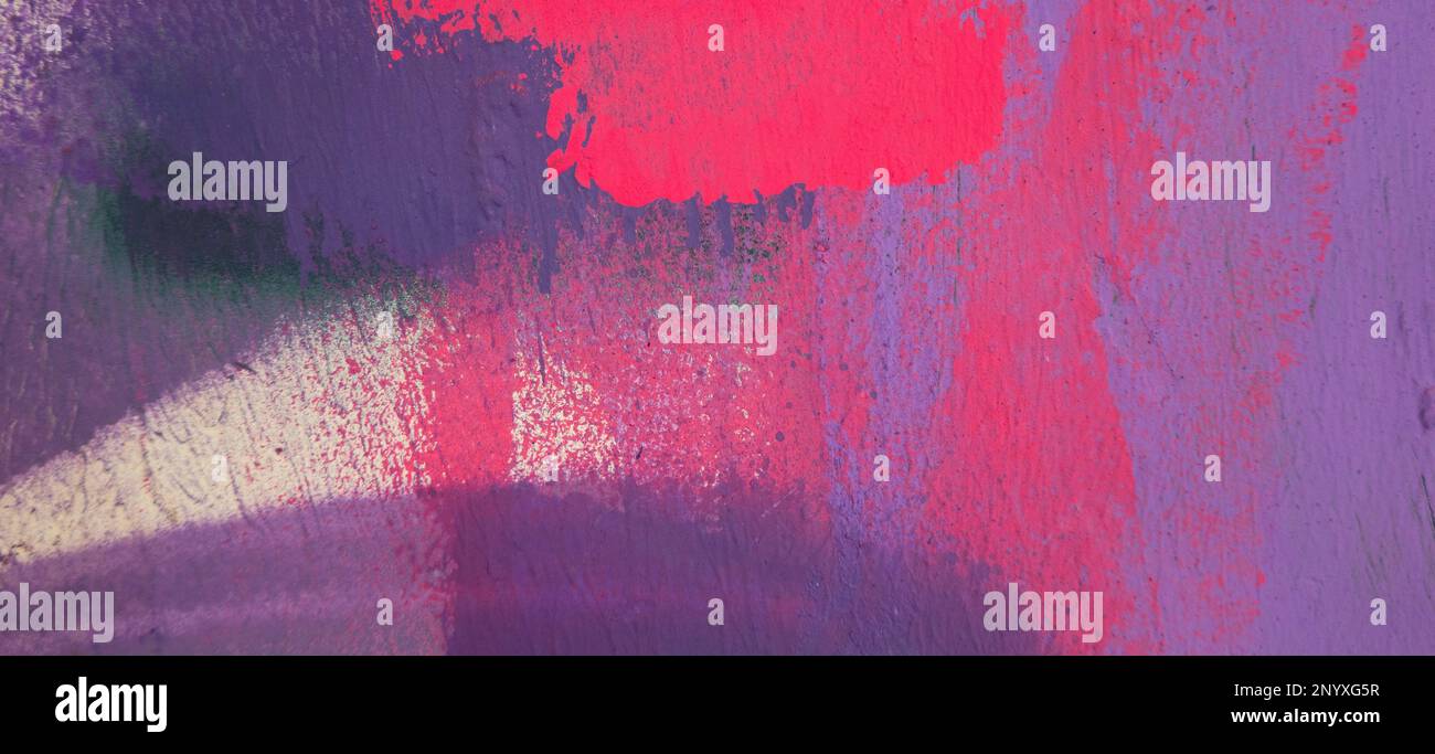 Messy paint strokes and smudges on an old painted wall with graffiti ...