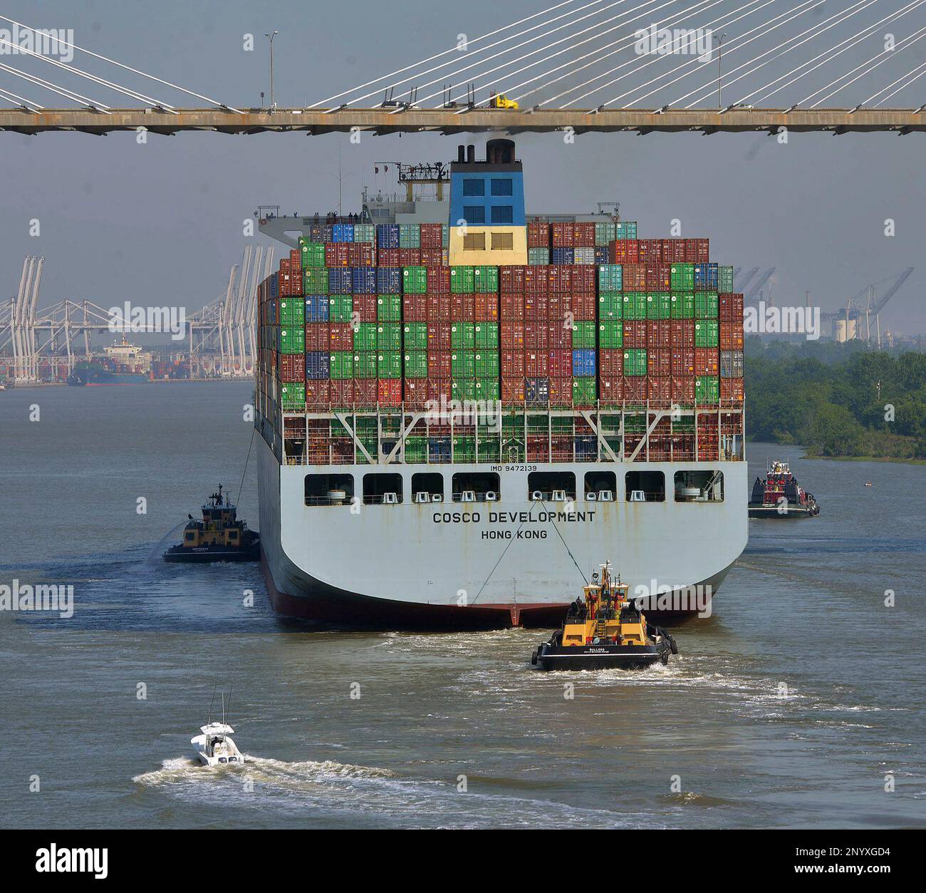 The container ship COSCO Development is guided under the Talmadge ...