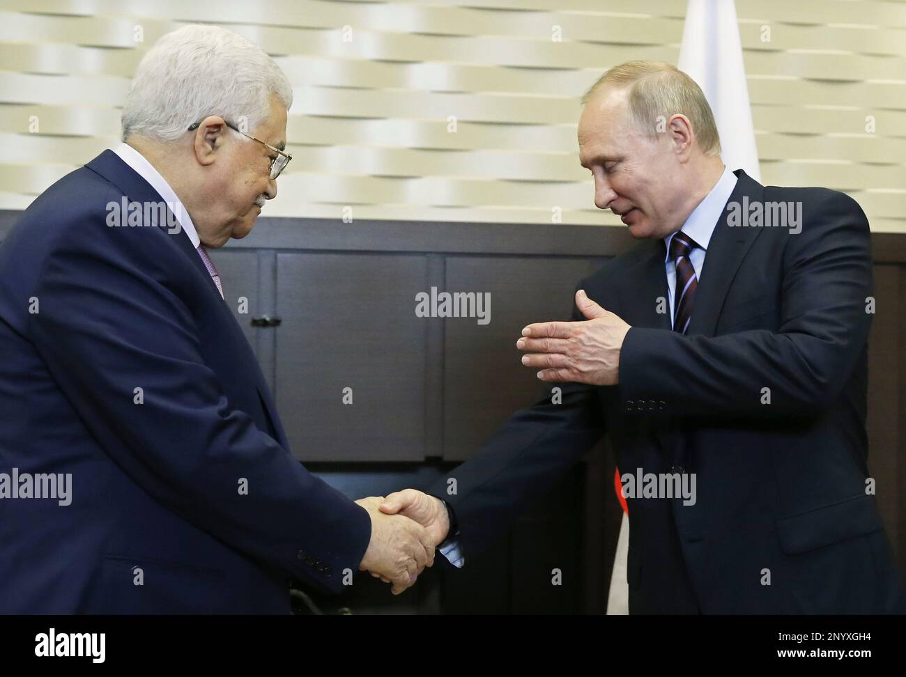 Russian President Vladimir Putin, right, shakes hands with Palestinian ...