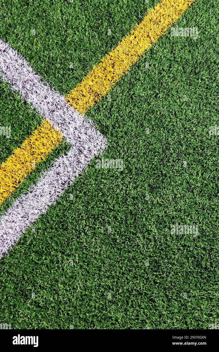 Green artificial grass turf soccer football field background with white ...