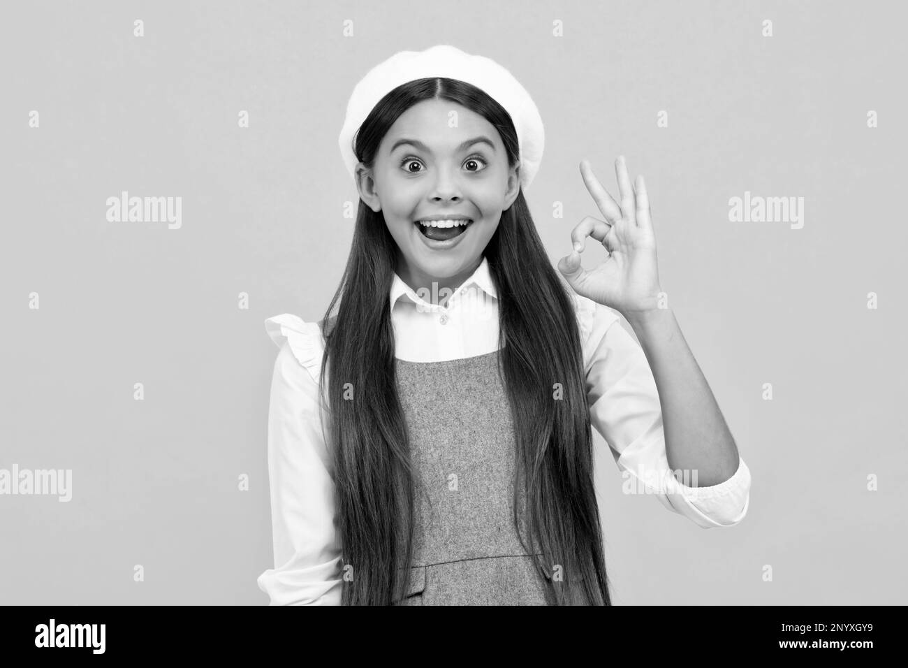 Portrait of teen girl making ok gesture, isolated background. Young ...