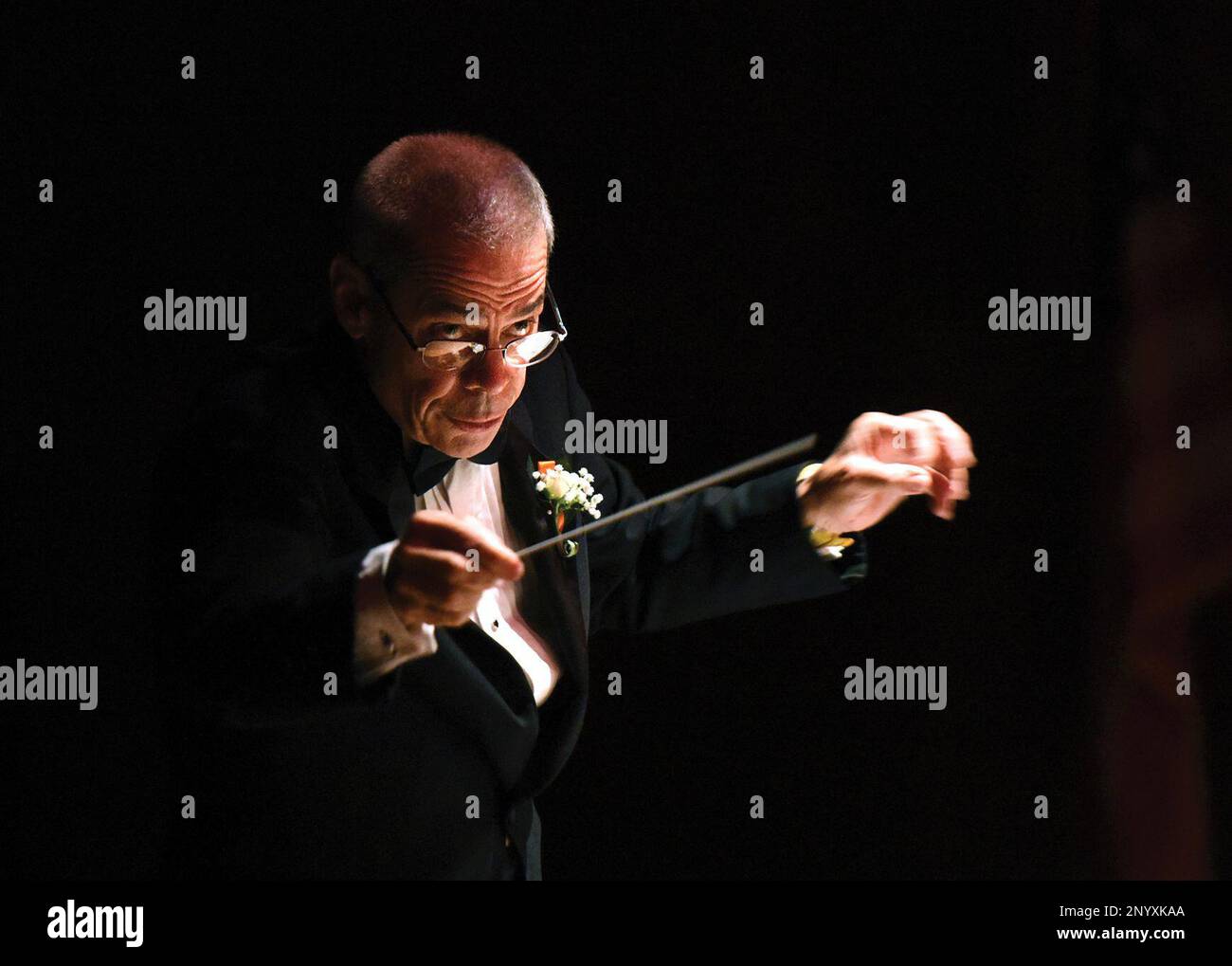 Band director Jim Kusserow conducts "The Cowboys" Friday, May 5, 2017 ...