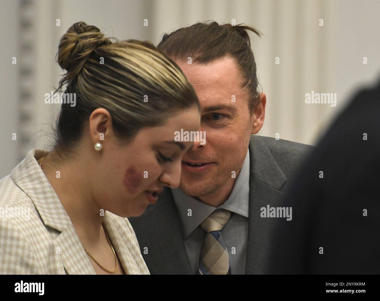 Zachariah Anderson, center, speaks with his attorney Nicole Muller ...