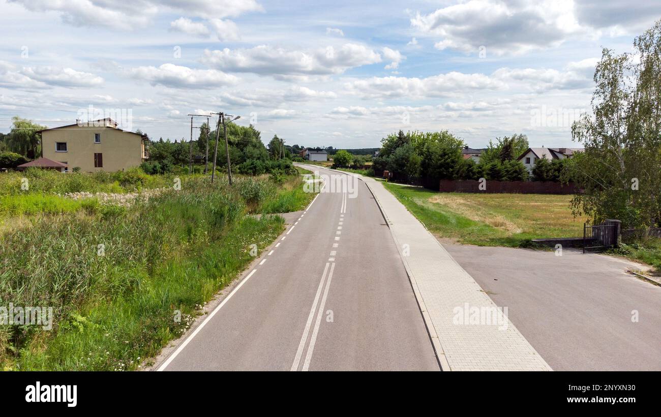 One single empty Polish road aerial view, no cars, calm rural area ...