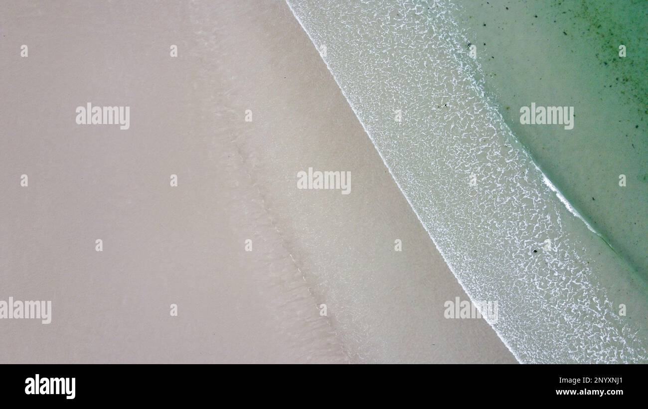 Soft wave of the sea on the beach Stock Photo - Alamy