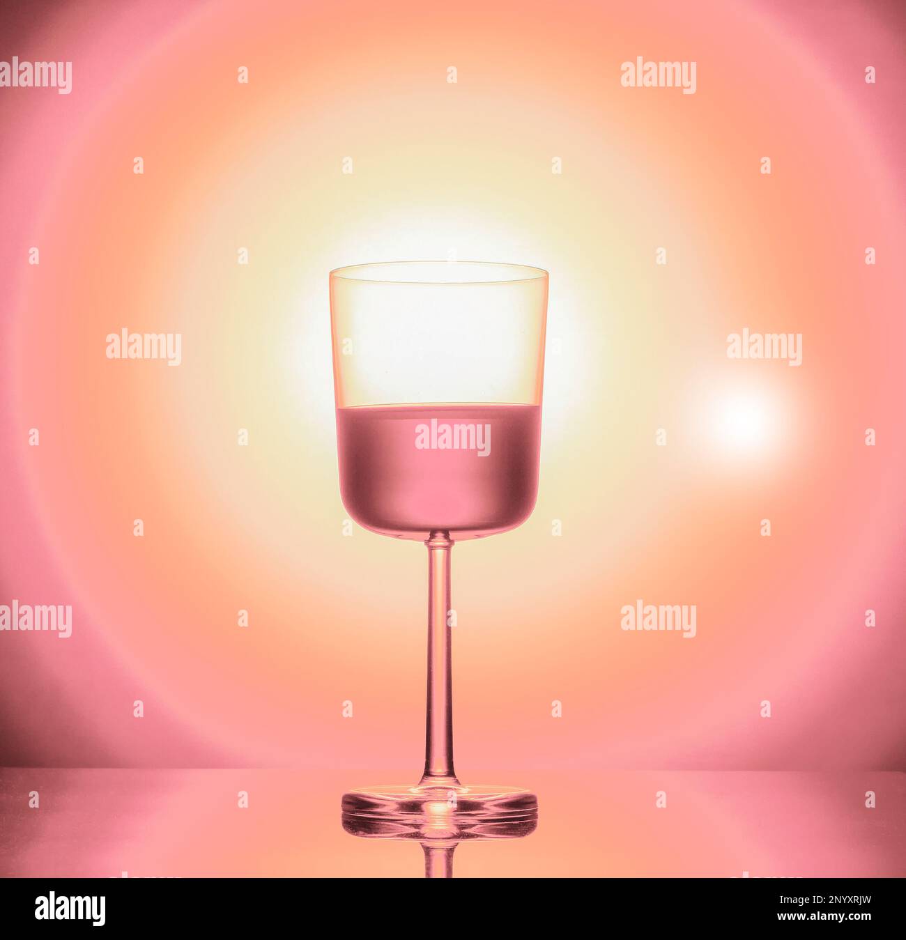 A glass of phantasmagoric wine on a lilac glowing gradient background ...