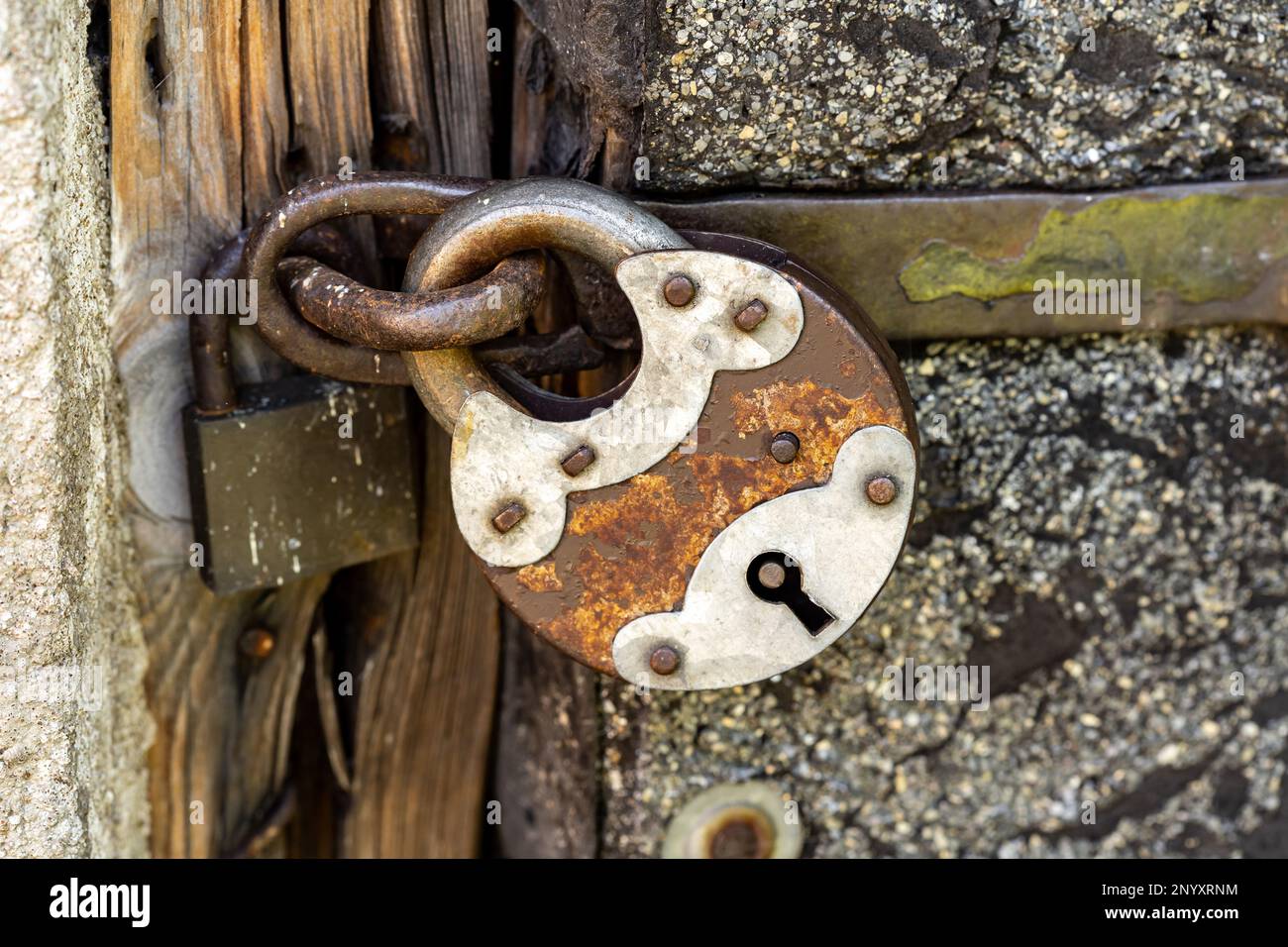 A large old rusty metal padlock, object detail, closeup, big steel lock ...