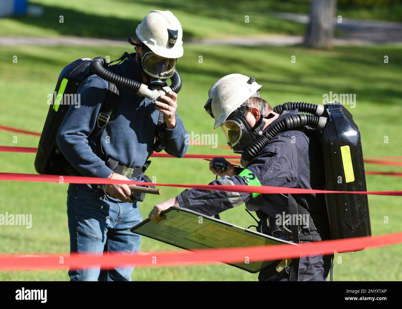 Team captain, Chris Carl, left, and Jeff Harner radio the briefing ...