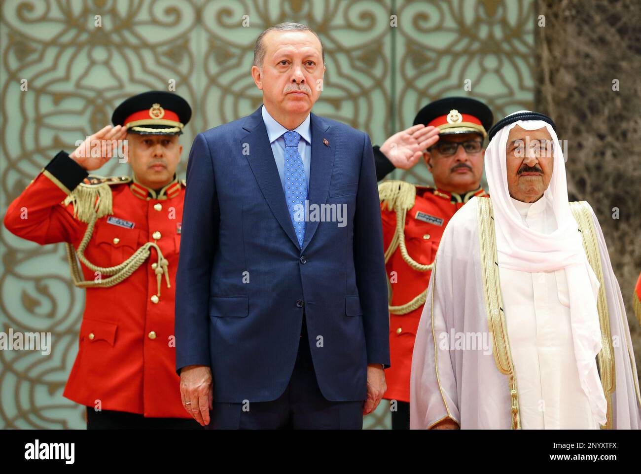 Turkey's President Recep Tayyip Erdogan, left, stands with Kuwait's ...