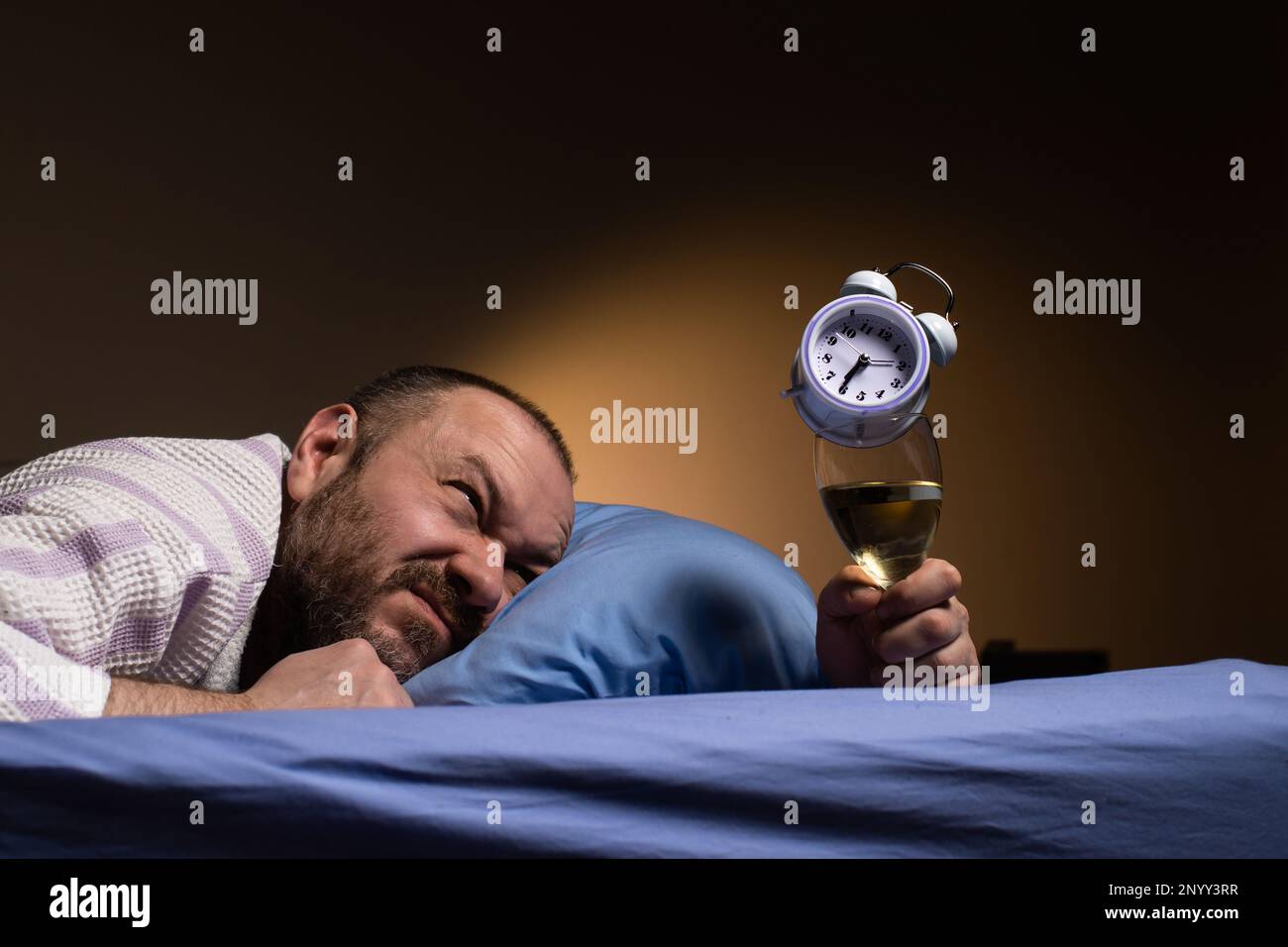 Man and alcoholism. Get drunk with alcohol and oversleep the alarm ...
