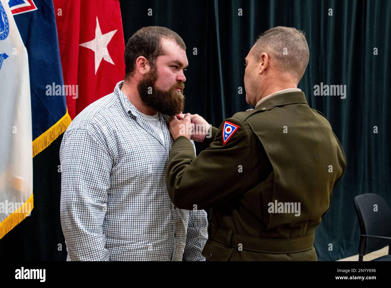 Brig. Gen. Thomas E. Moore II, right, presents the Ohio Commendation ...