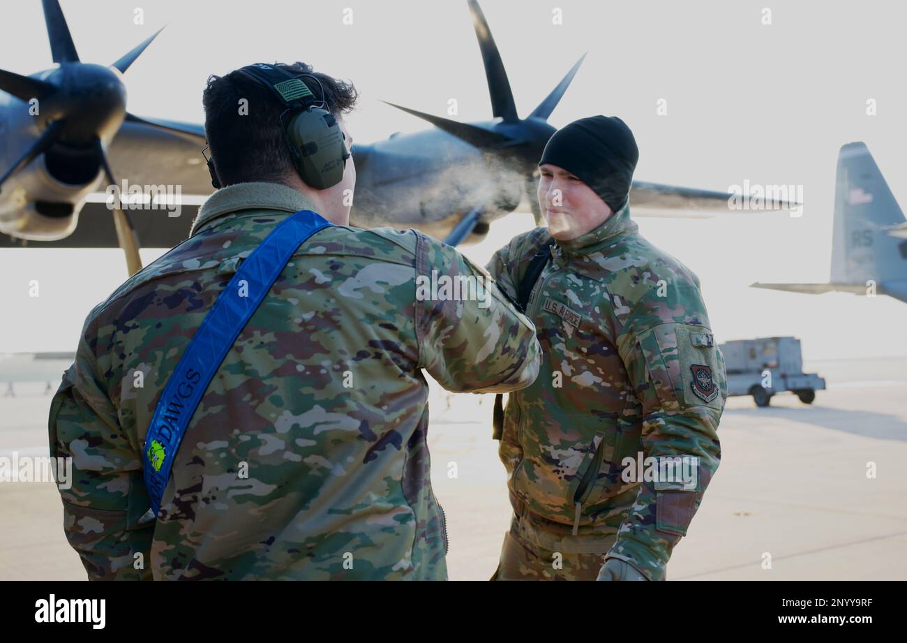 U.S. Air Force Airman 1st Class David Hanus (left) fist bumps Senior ...