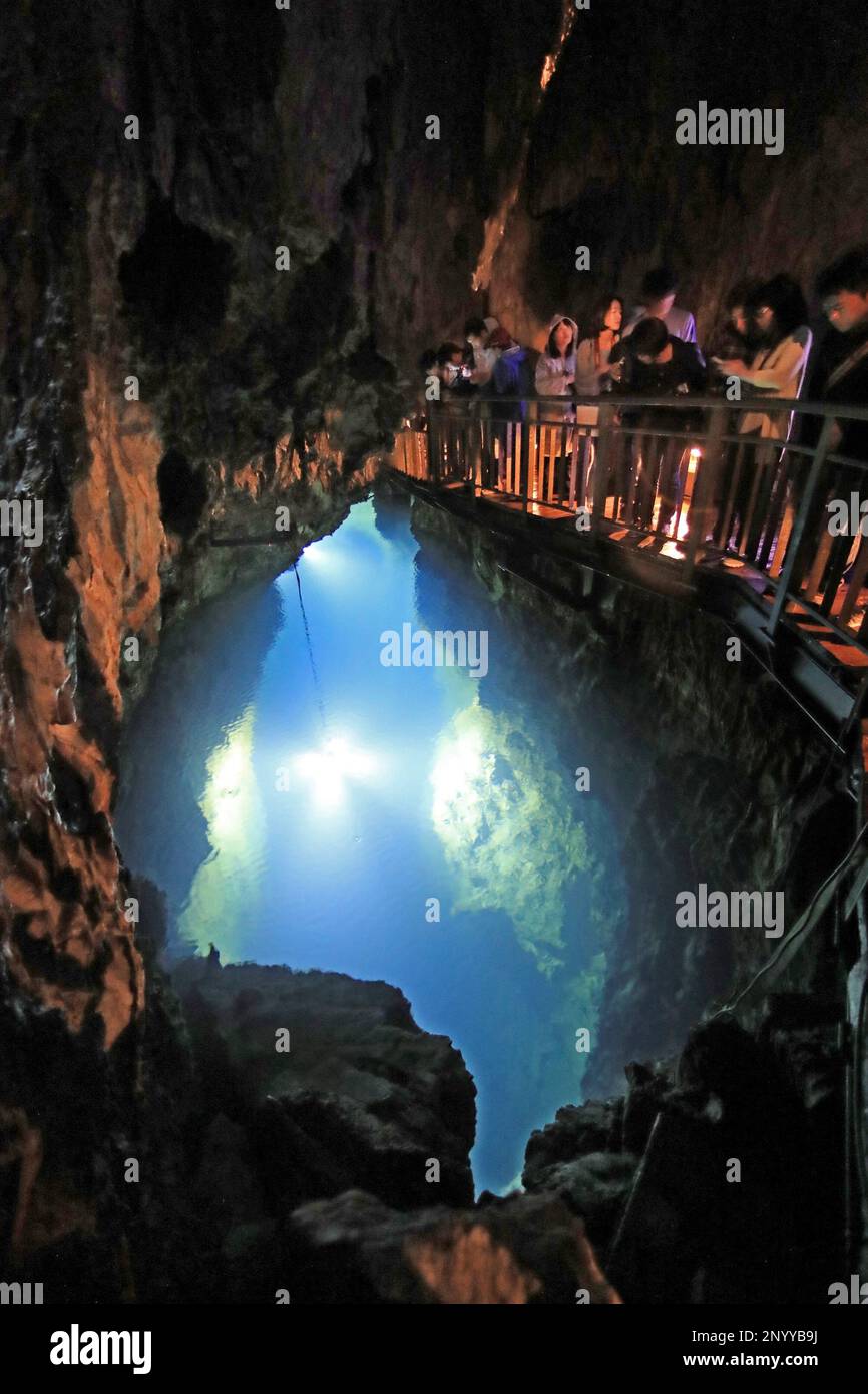 A group of travelers view the Ryusendo, one of Japan's three biggest ...