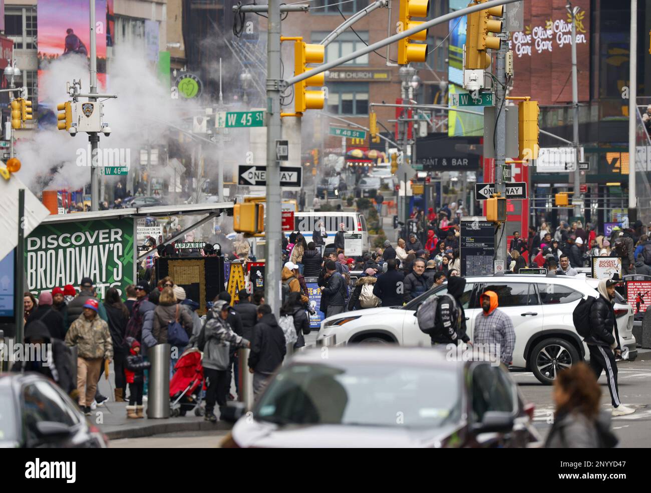 New York, United States. 02nd Mar, 2023. Pedestrians walk through Times ...