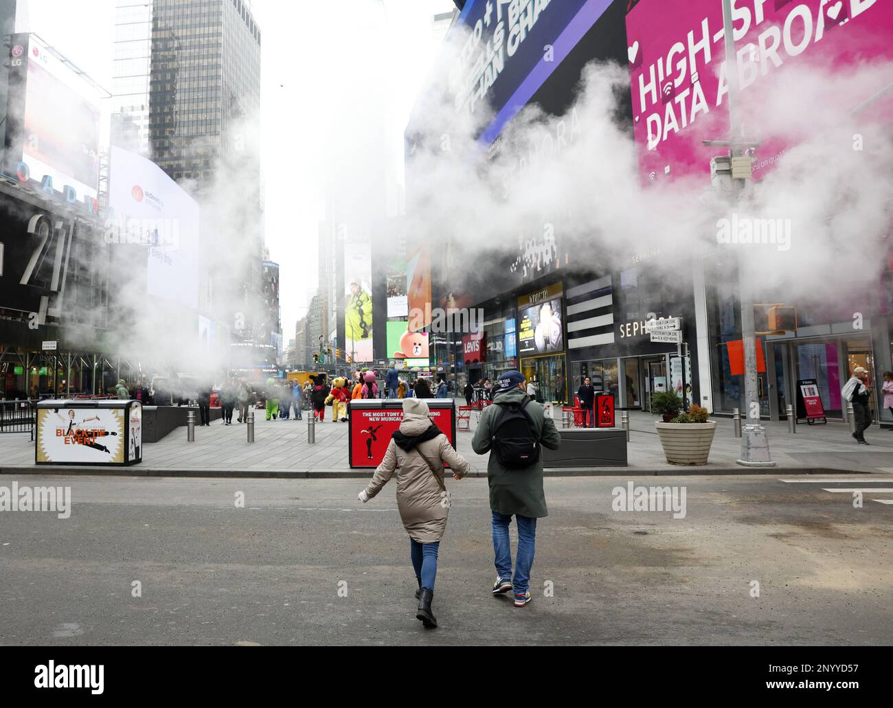 New York, United States. 02nd Mar, 2023. Pedestrians walk through Times ...