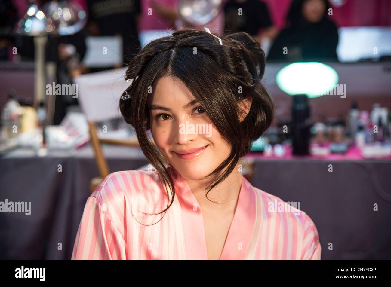 Model Sui He prepares backstage before the 2015 Victoria's Secret ...